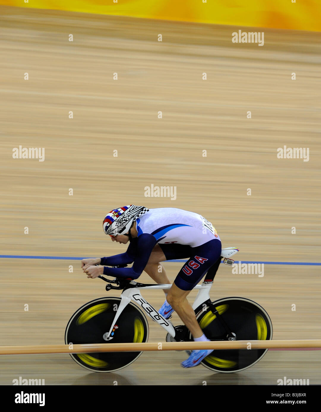 Rider competes in men individual pursuit cycling track race at the 2008 ...