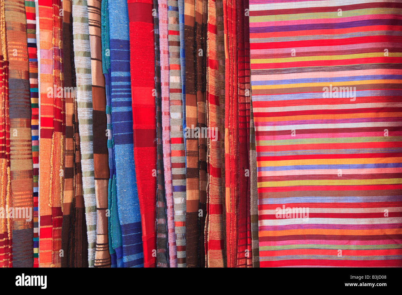 Colorful textiles for sale in the Souk or market in Marrakesh Morocco ...
