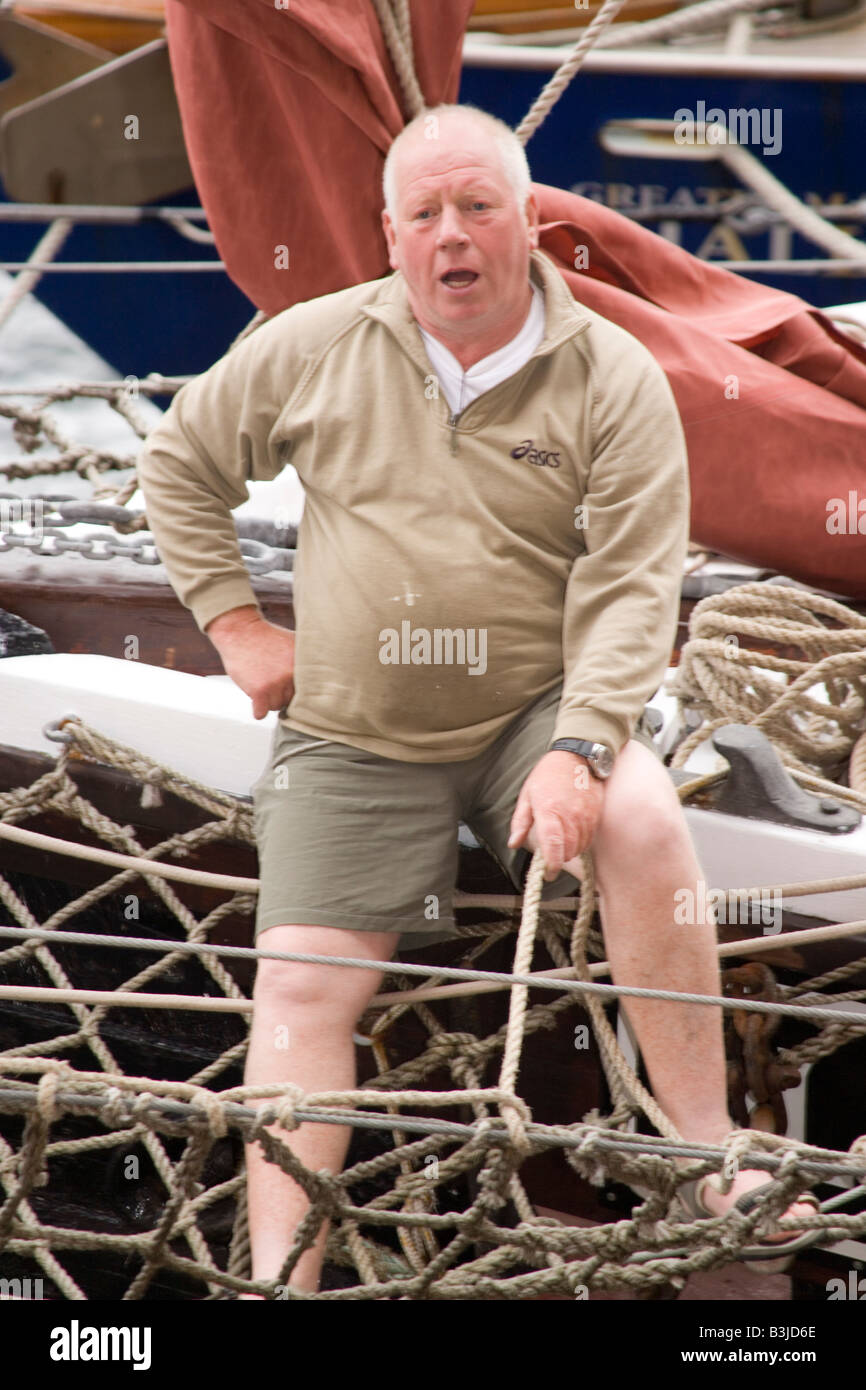 Sailor working on rigging on the Glaciere of Liverpool sailing ship at ...