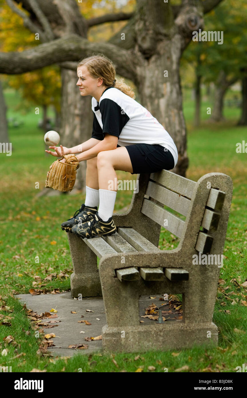 Portrait of a young female softball player Stock Photo - Alamy