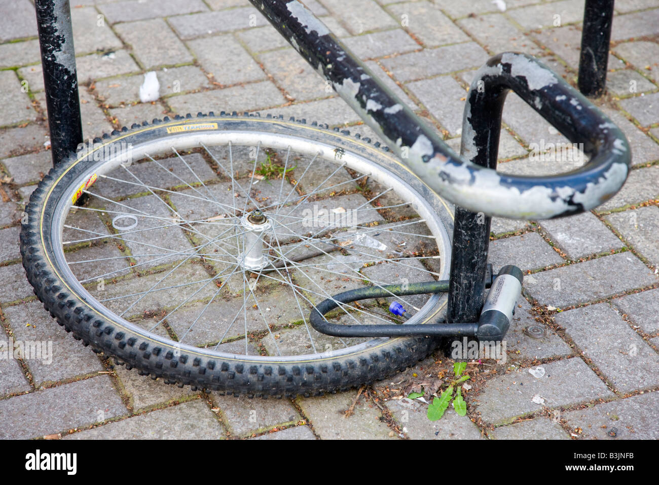 Bicycle wheel chained to rail Stock Photo - Alamy Bicycle wheel chained to rail Stock Photo - Alamy