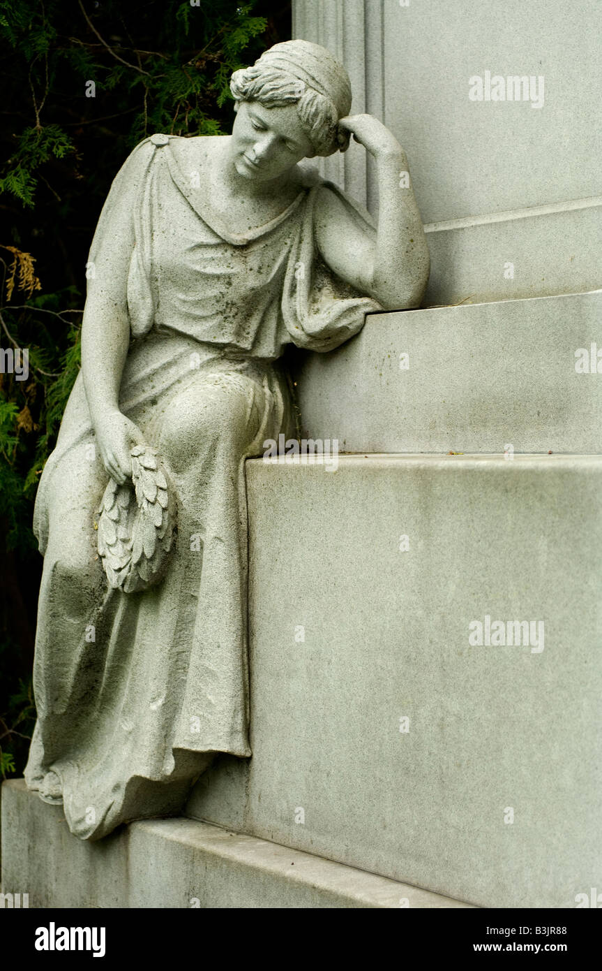 A carved woman in a cemetery Stock Photo - Alamy