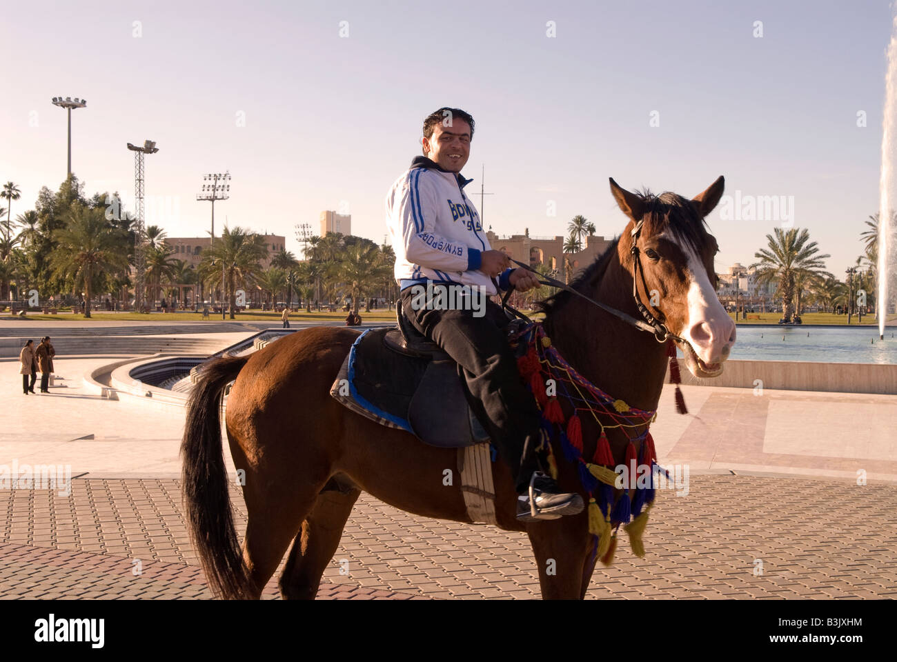 Young Libyan man on horseback in parkland near Green Square Tripoli ...