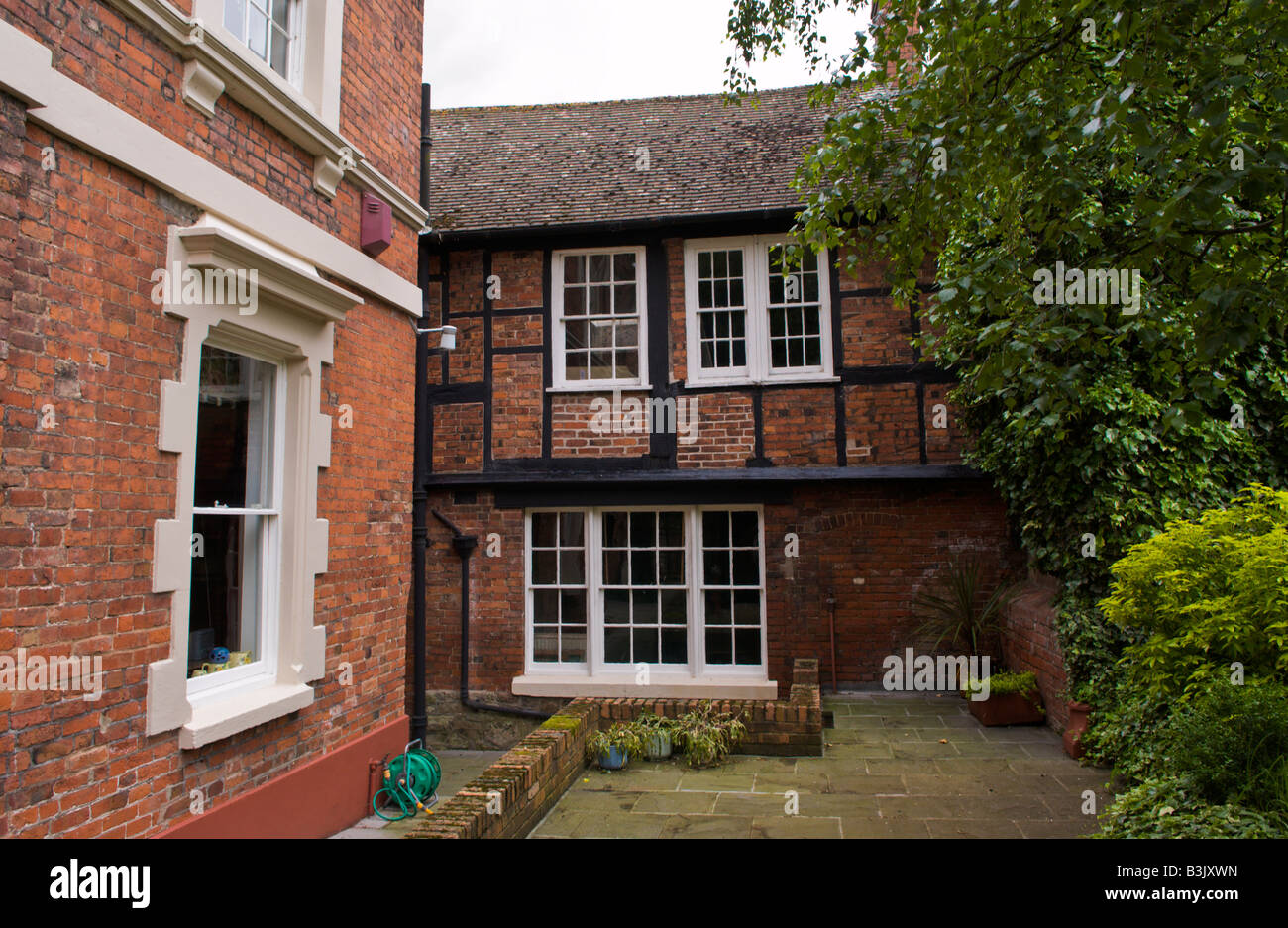 Half timbered former pub built on former quay on banks of River Wye at ...