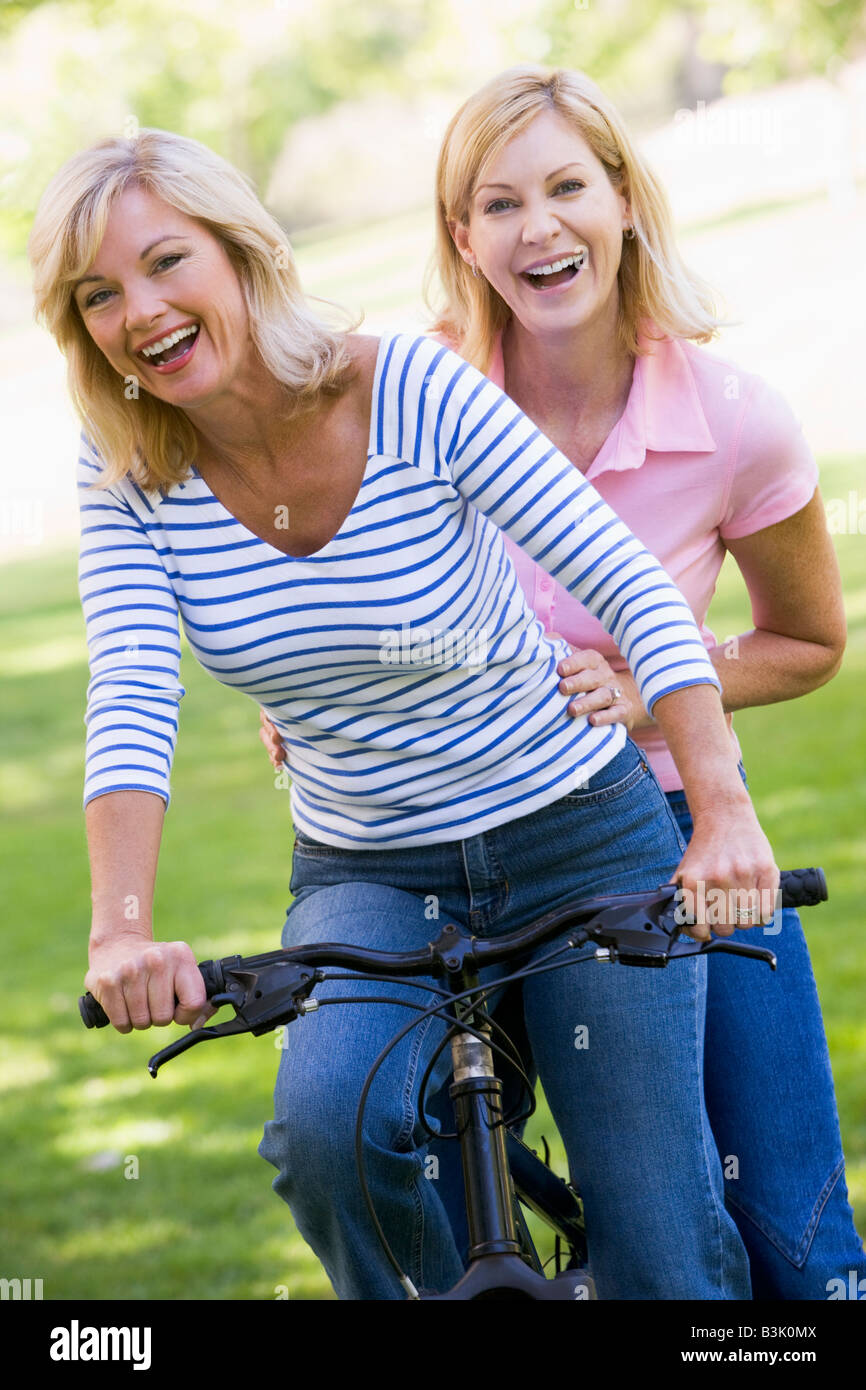 Two friends on one bike hi-res stock photography and images - Alamy