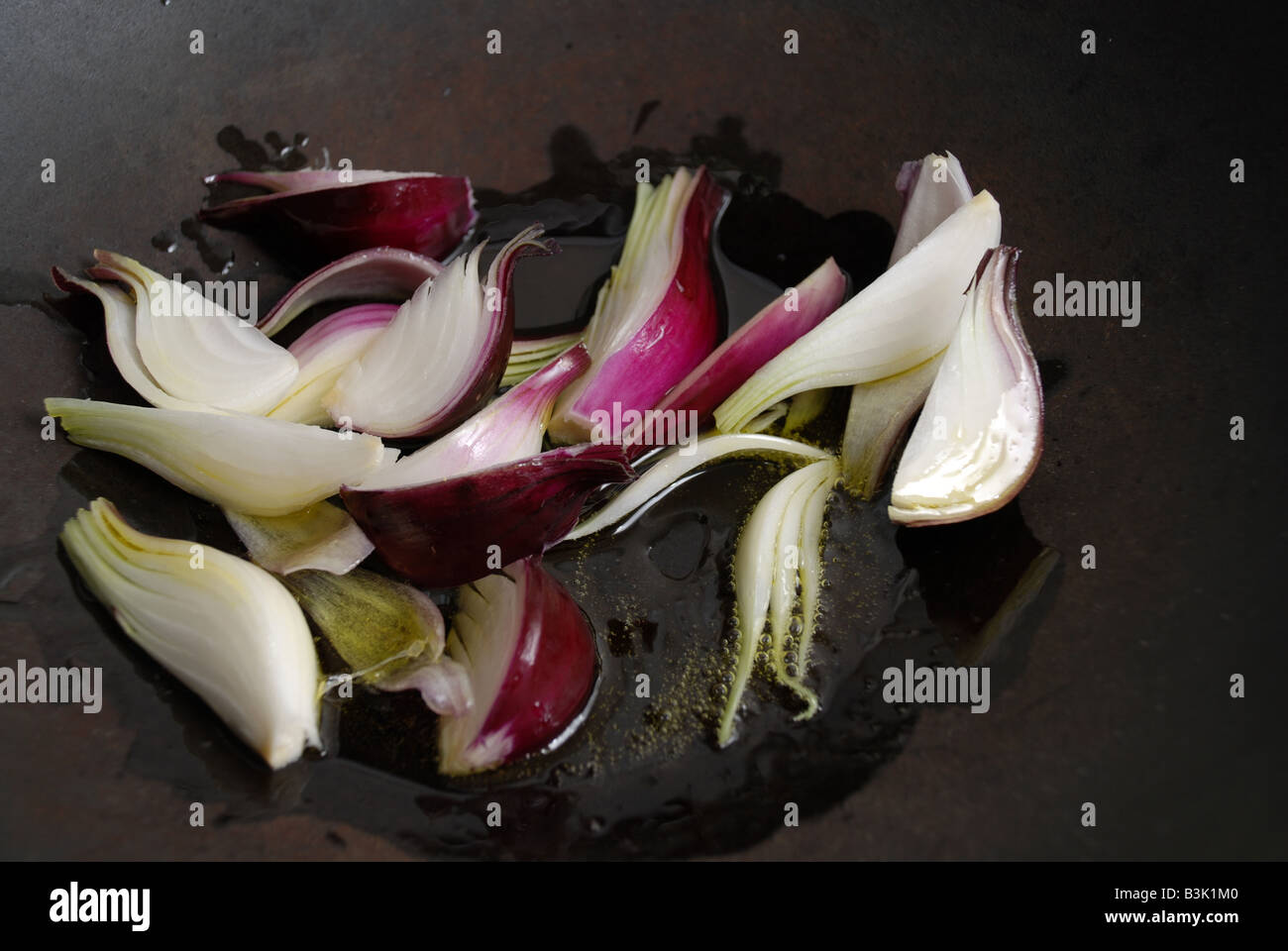 Frying onions in a frying pan Stock Photo - Alamy