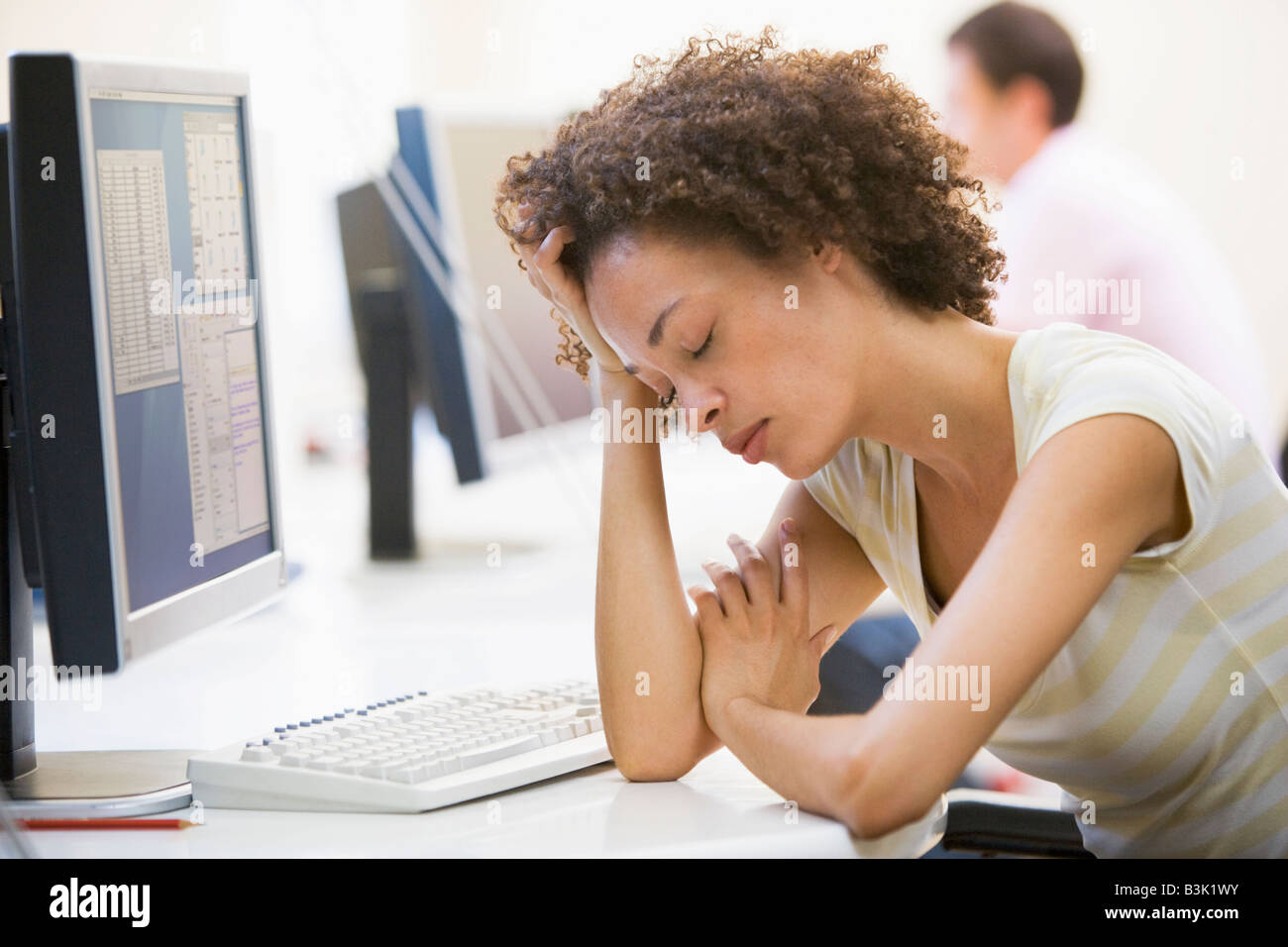 Woman in computer room sleeping Stock Photo - Alamy
