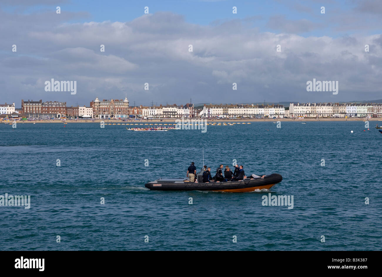 A boat full of divers heads out to sea off the coast of Weymouth in ...