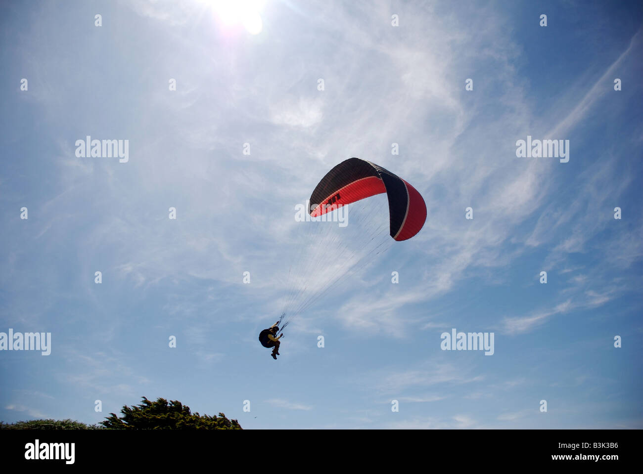 Parascender in mid flight Stock Photo - Alamy