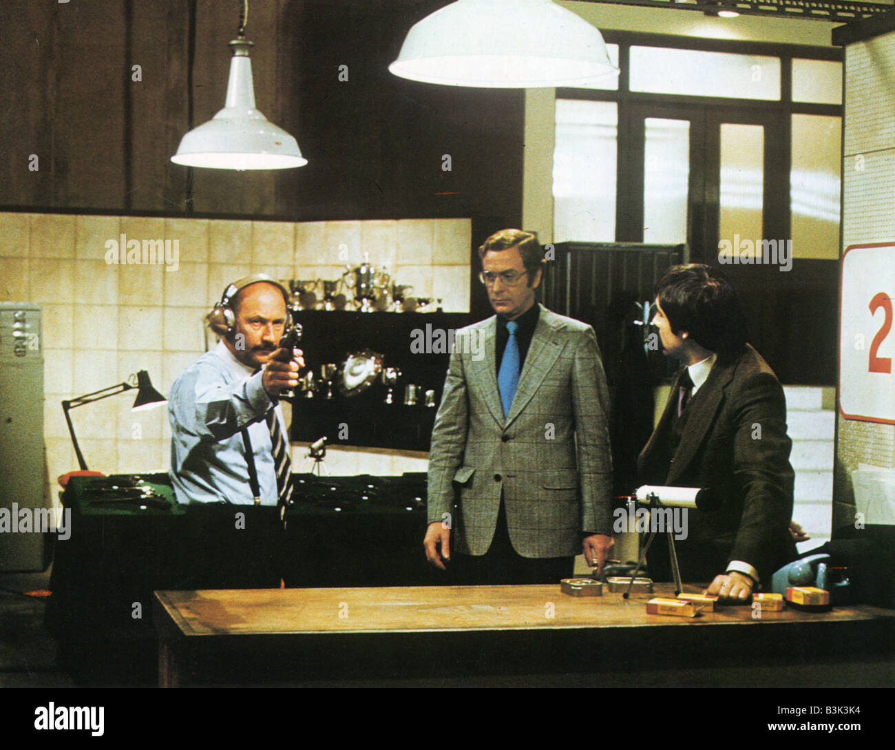 THE BLACK WINDMILL 1974 Universal film with Michael Caine centre Stock ...