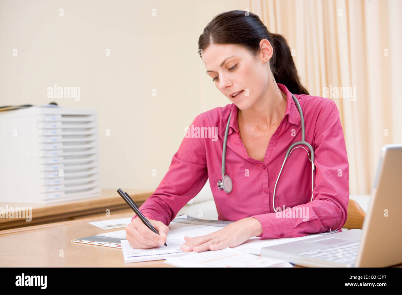 Doctor gp writing hi-res stock photography and images - Alamy