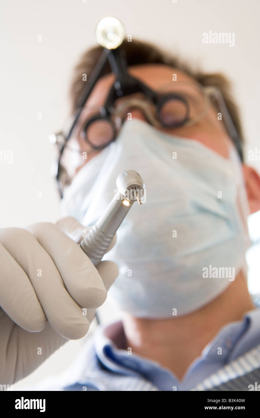 Dentist holding drill Stock Photo - Alamy