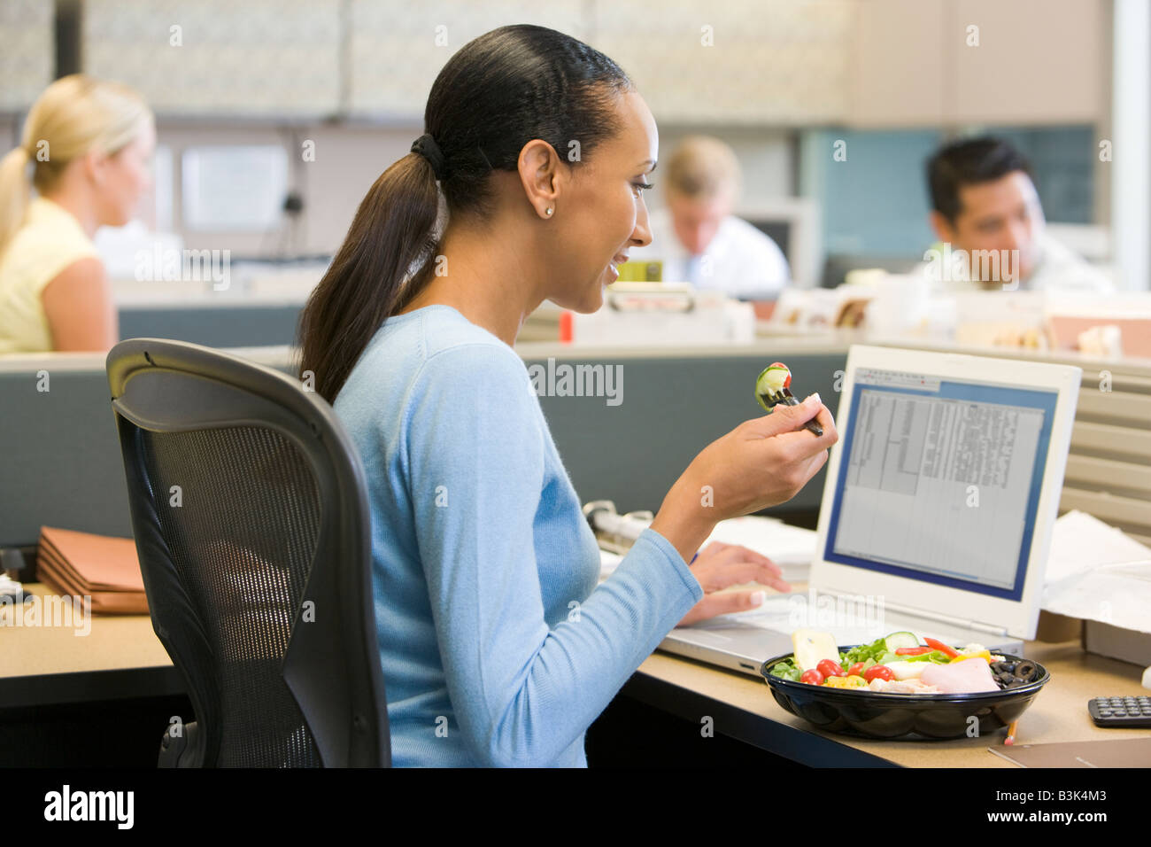 Woman eating sushi office desk hi-res stock photography and images - Alamy