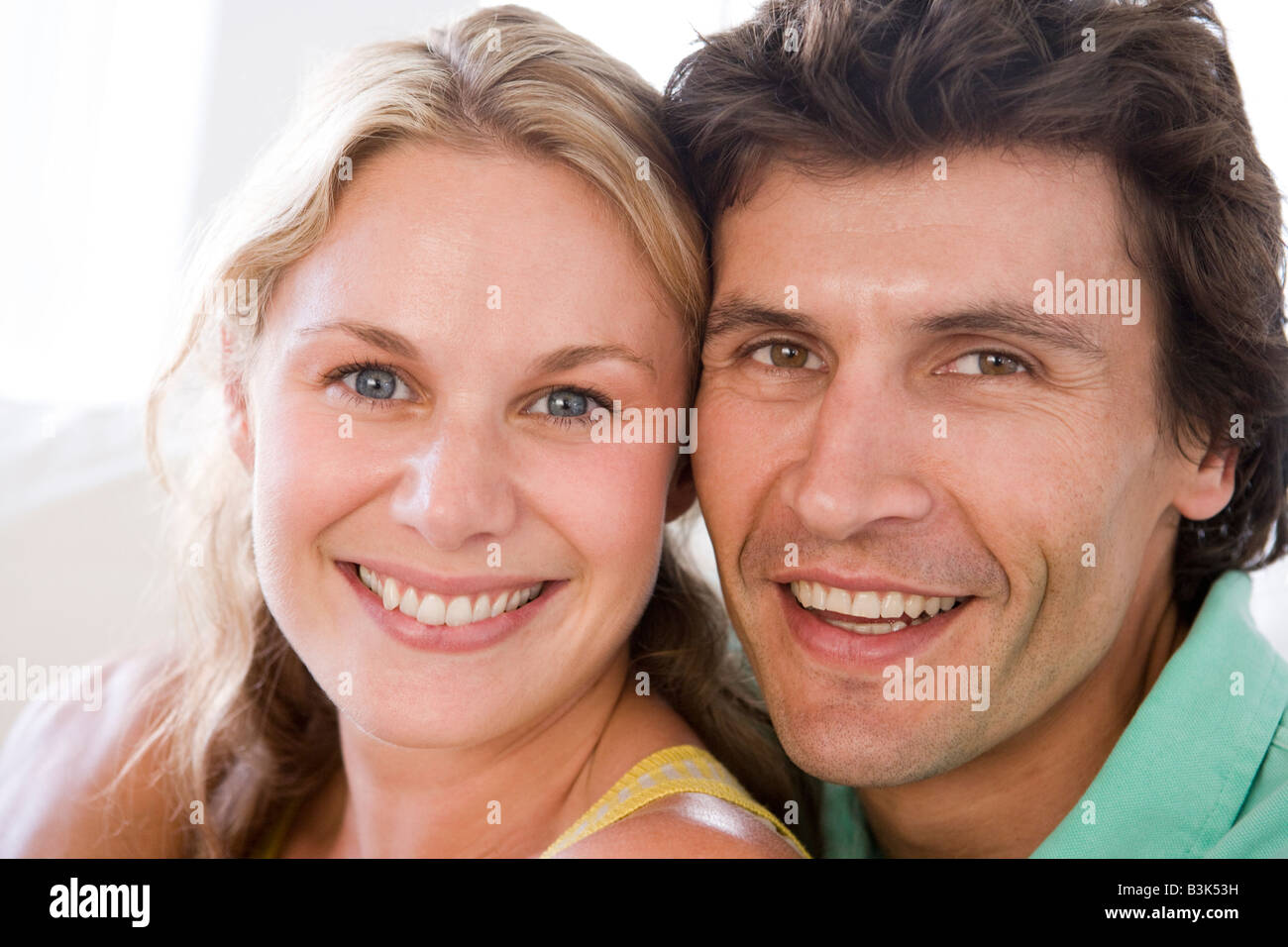 Couple together smiling Stock Photo - Alamy
