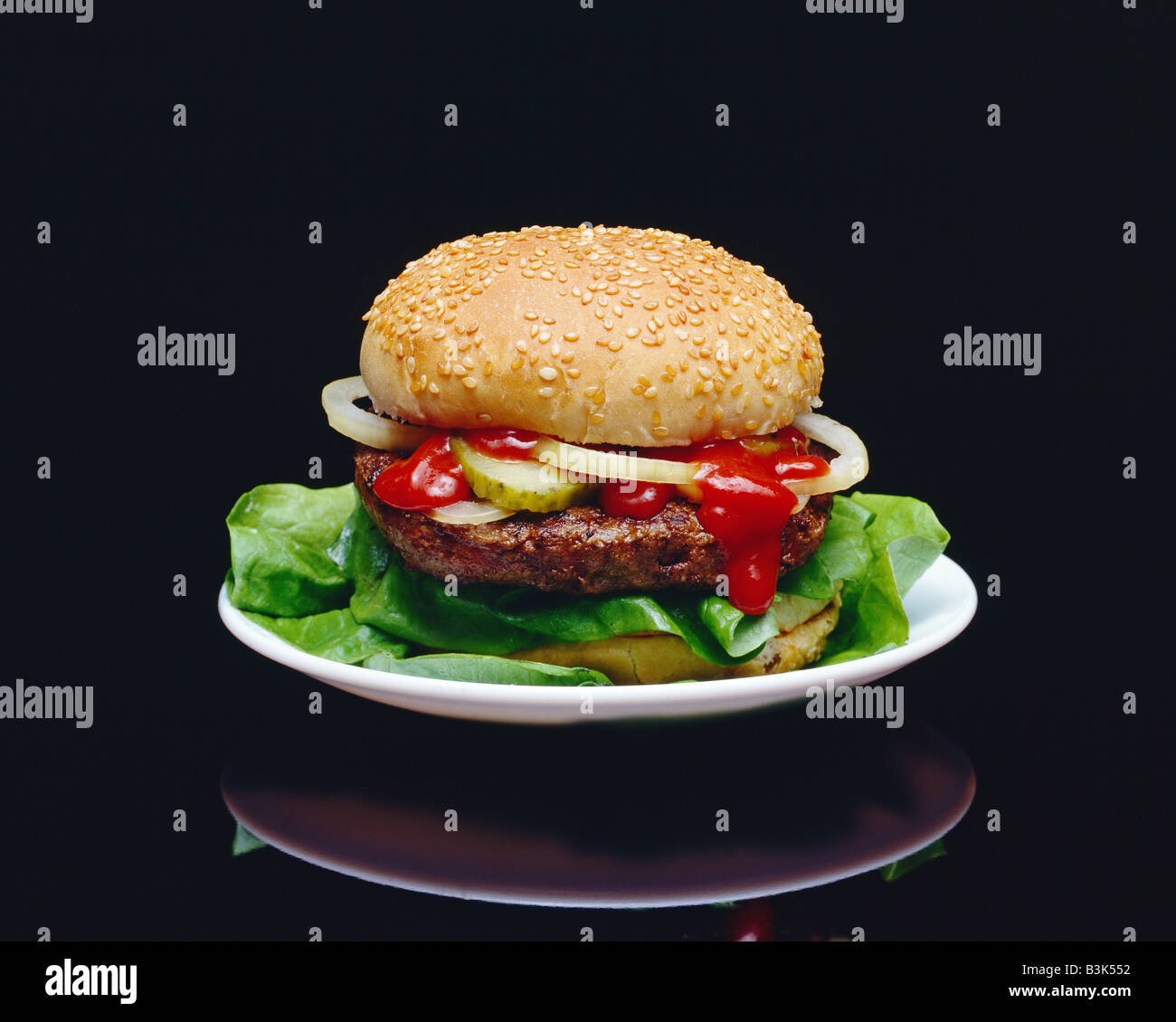 ONE HAMBURGER WITH KETCHUP SAUCE AND SALAD LEAVES Stock Photo - Alamy