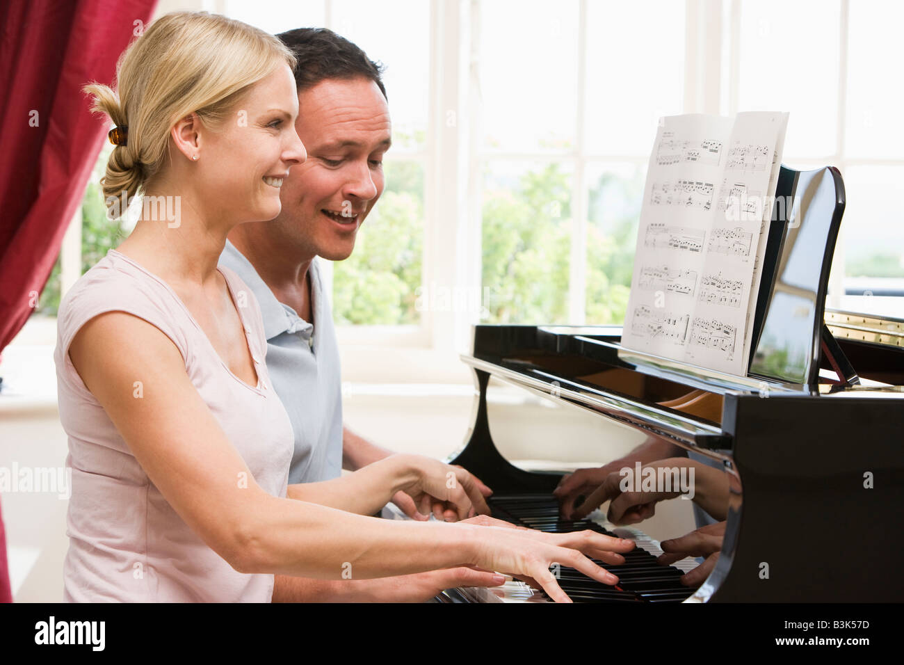Man playing grand piano hi-res stock photography and images - Alamy