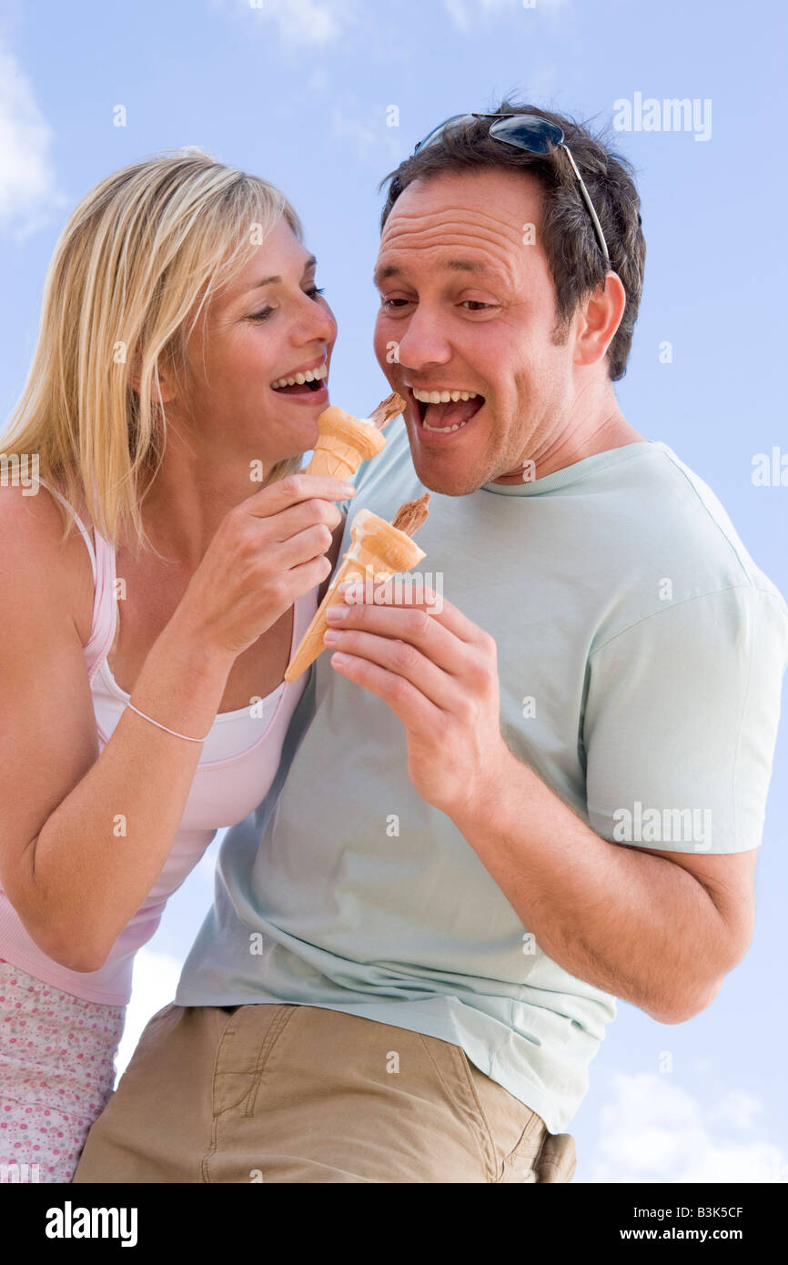 Couple man woman holiday eat ice cream hi-res stock photography and ...