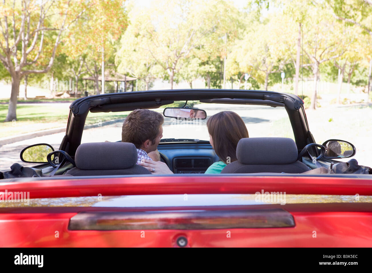 Couple in convertible car Stock Photo - Alamy