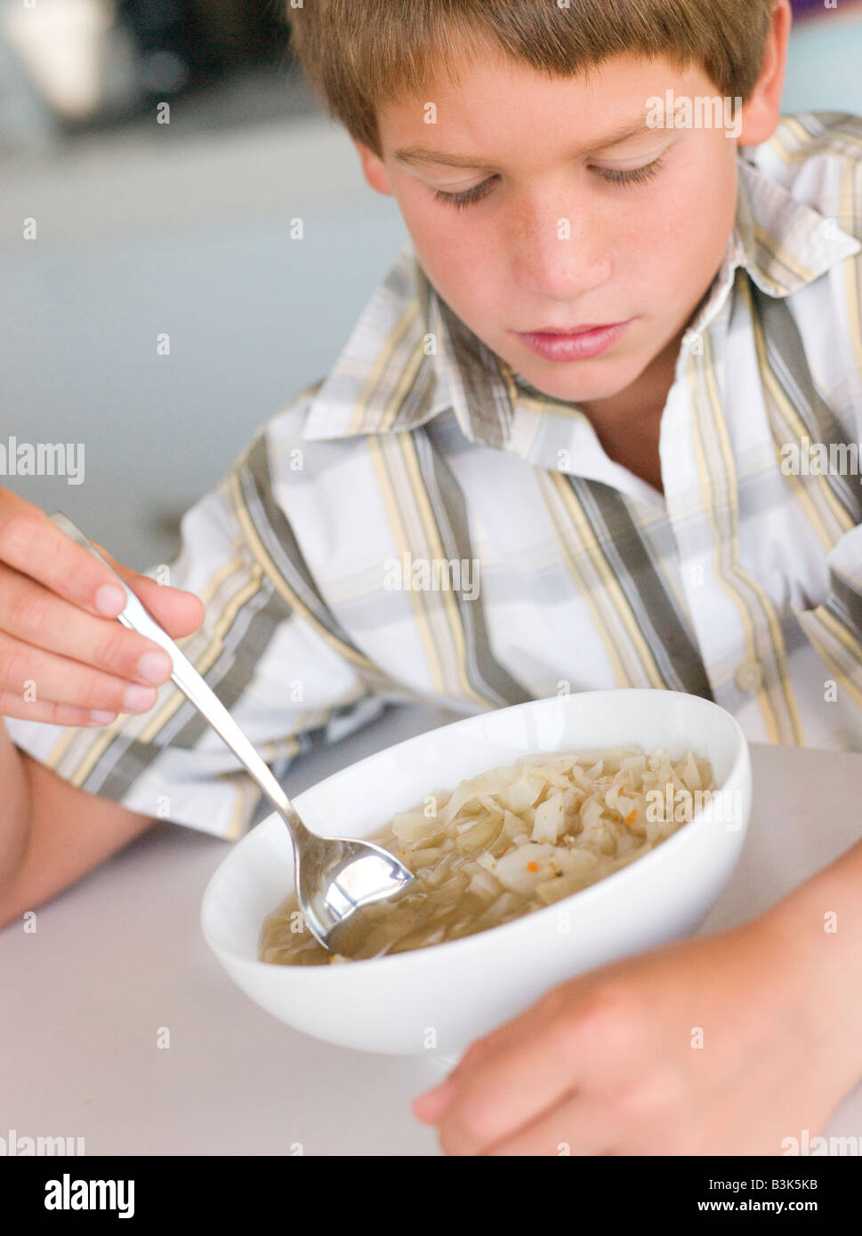 Children eating in soup kitchen hi-res stock photography and images - Alamy