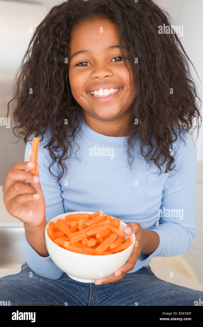Children eating vegetable sticks hi-res stock photography and images ...