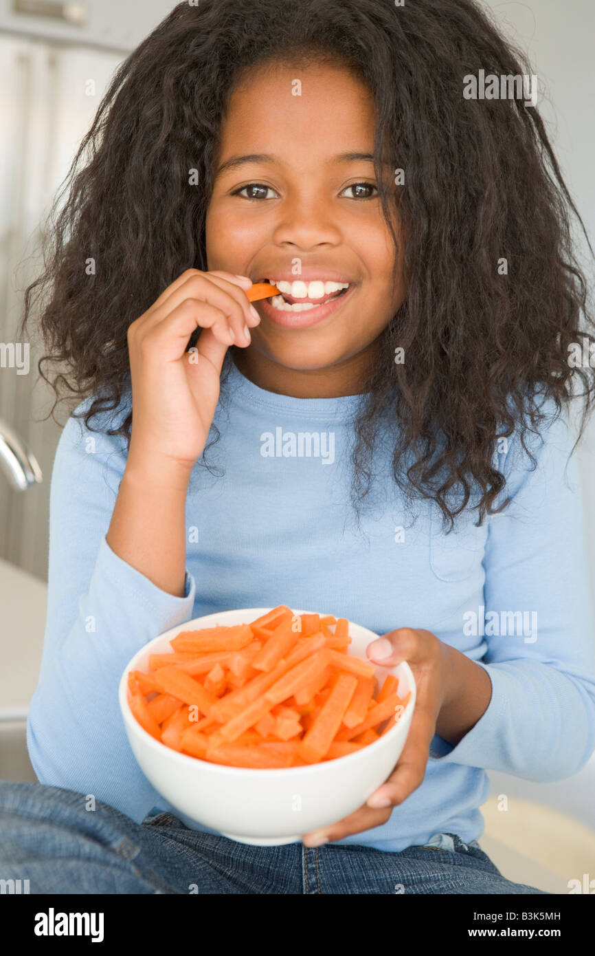 Children eating vegetable sticks hi-res stock photography and images ...