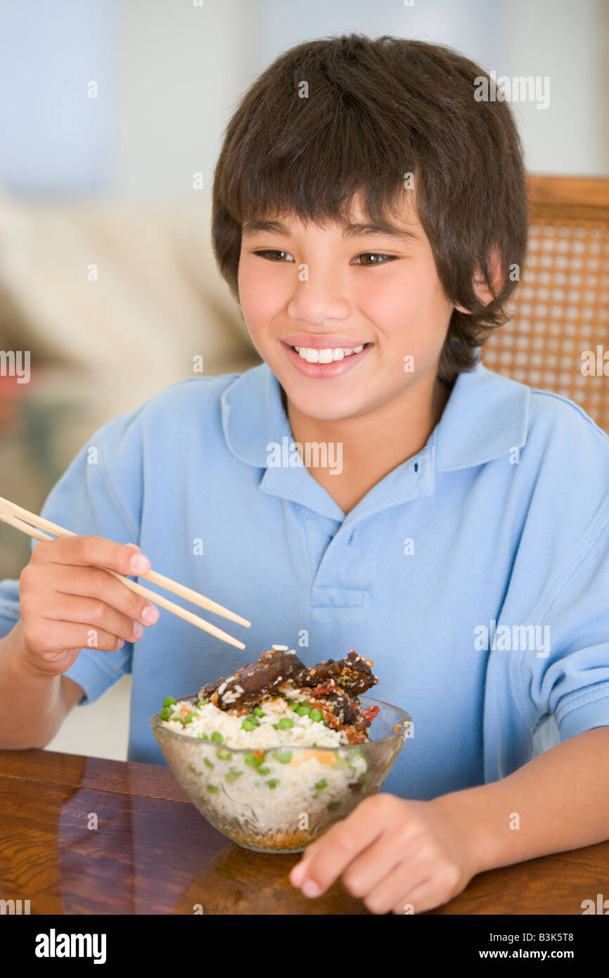 Boy eating chopsticks hi-res stock photography and images - Alamy