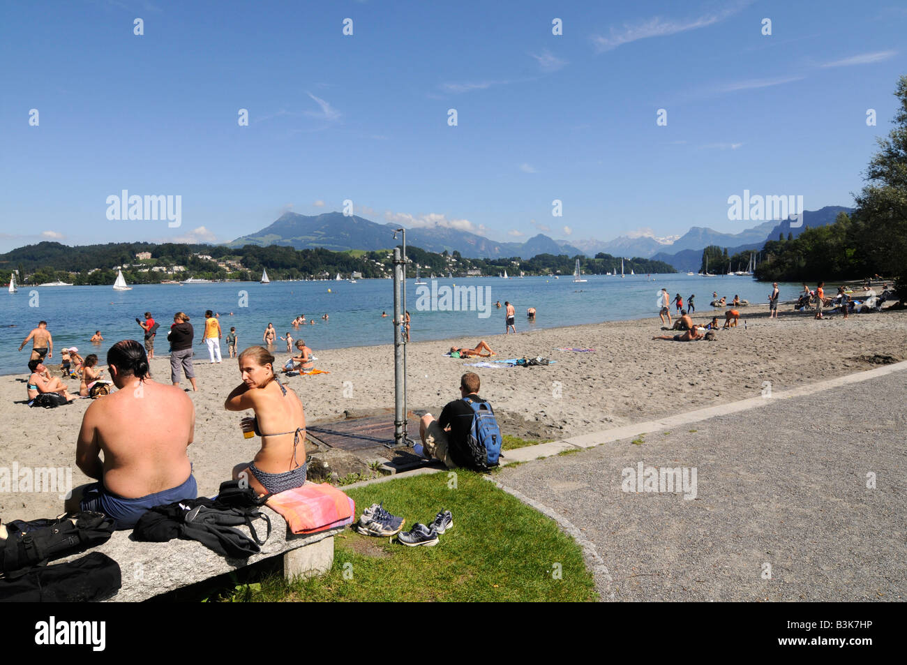 Swiss People Sunbathing And Enjoying A Beautiful On A Beach On The
