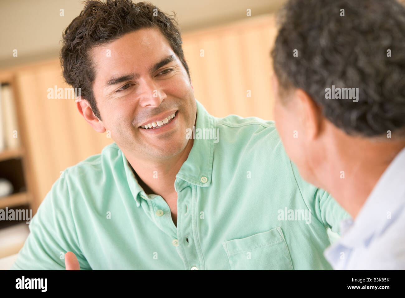 Two men talking home hi-res stock photography and images - Alamy
