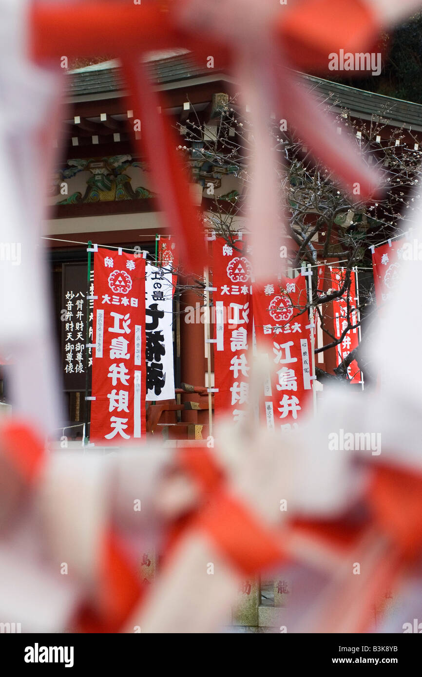 Red and white prayer flags at the Kotoku-in Temple in Enoshima, Japan ...