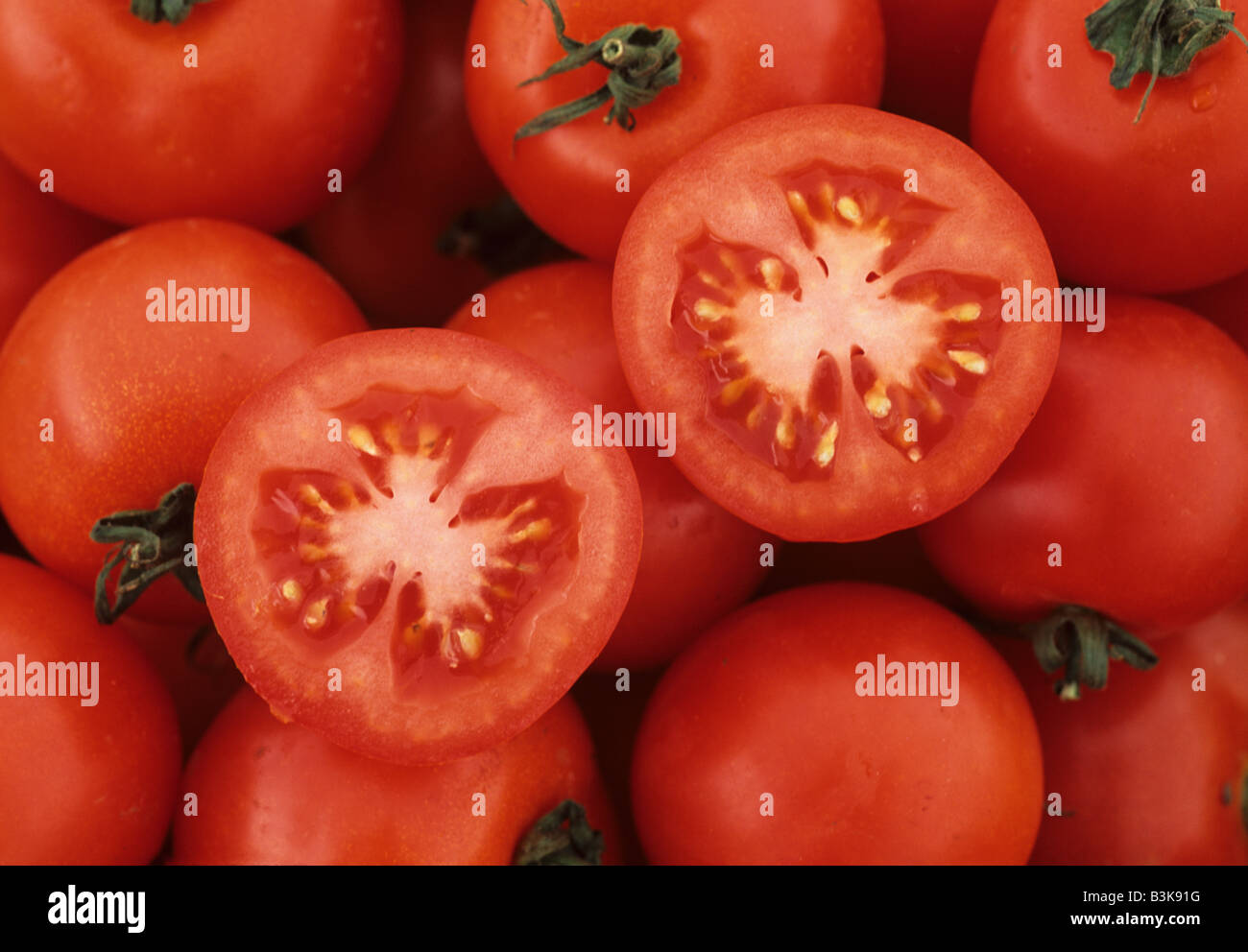 Two half cut tomato tomatoes hi-res stock photography and images - Alamy