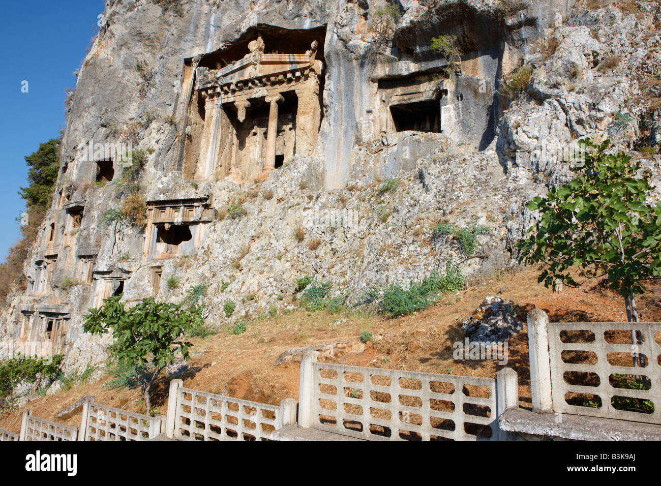 Ancient Lycian rock cut tombs located in modern town of Fethiye ...