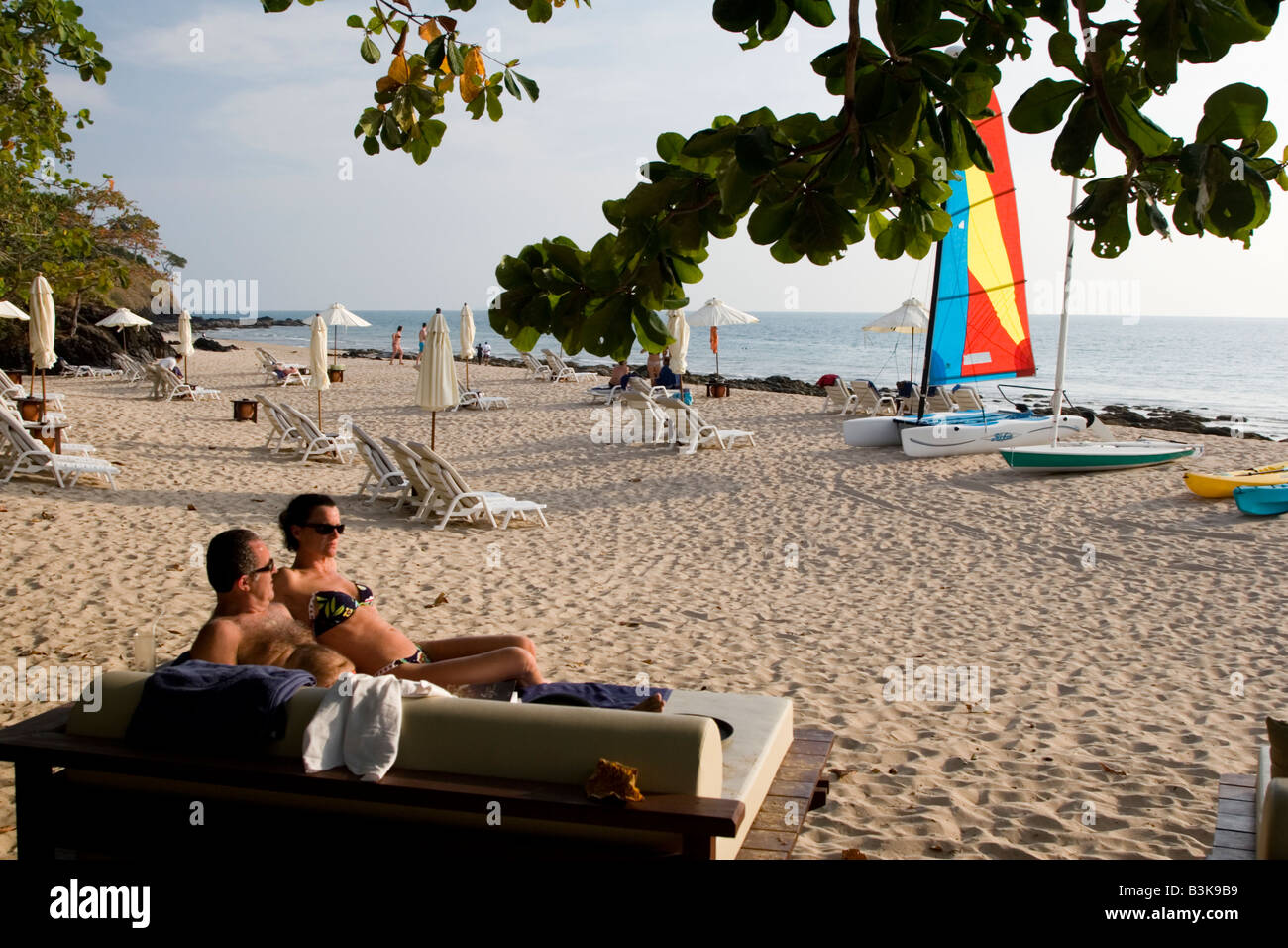 Tourists sunbathe on beach hi-res stock photography and images - Alamy