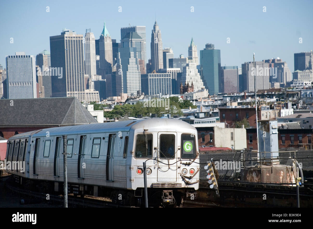 MTA subway train in the foreground with Manhattan skyline in the ...