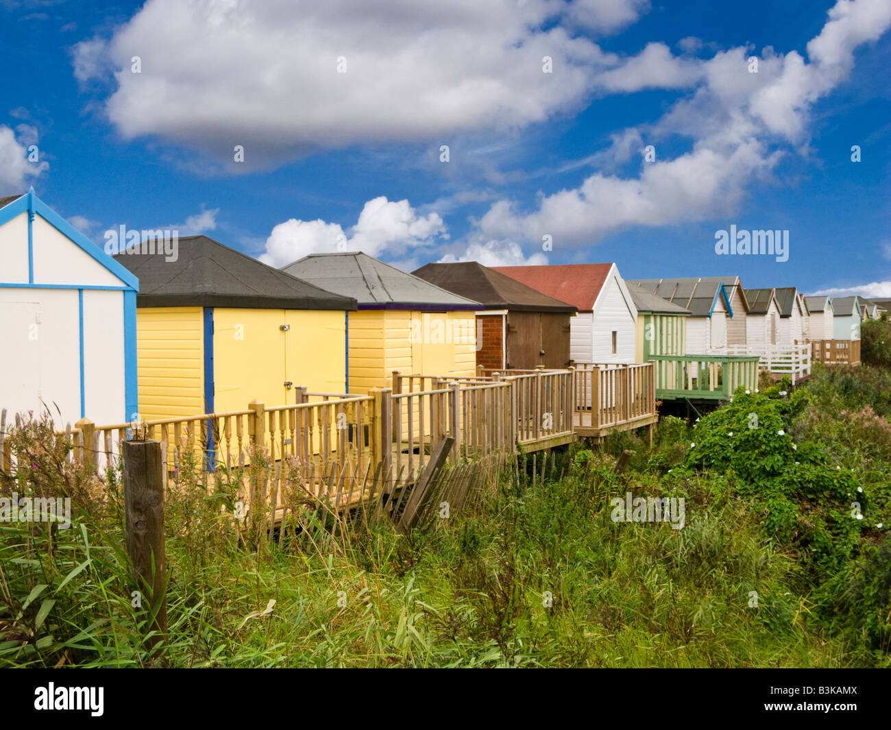 Row of painted old wooden bathing huts at "Chapel St Leonards" beach ...