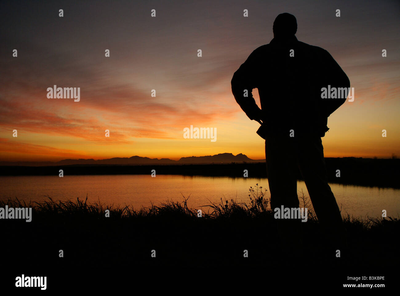 Watching the sunset Stock Photo - Alamy