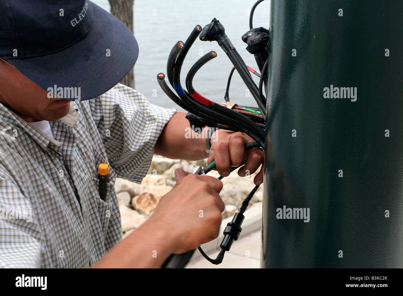 Electrician splicing wires Stock Photo - Alamy