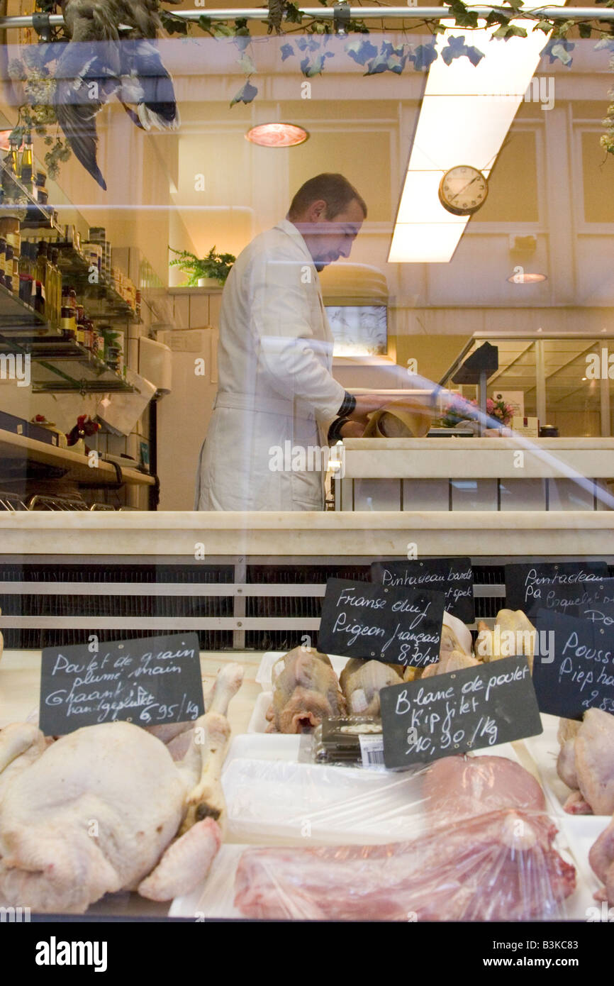 Window display of butchers showing local fresh game and fowl produce ...