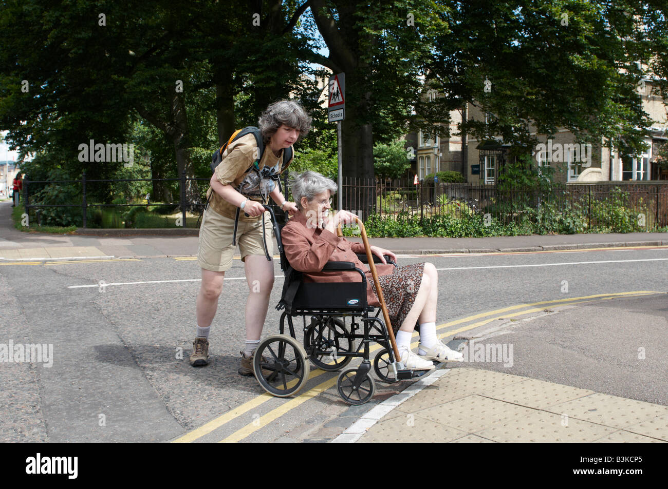 Children Helping The Elderly Cross The Road