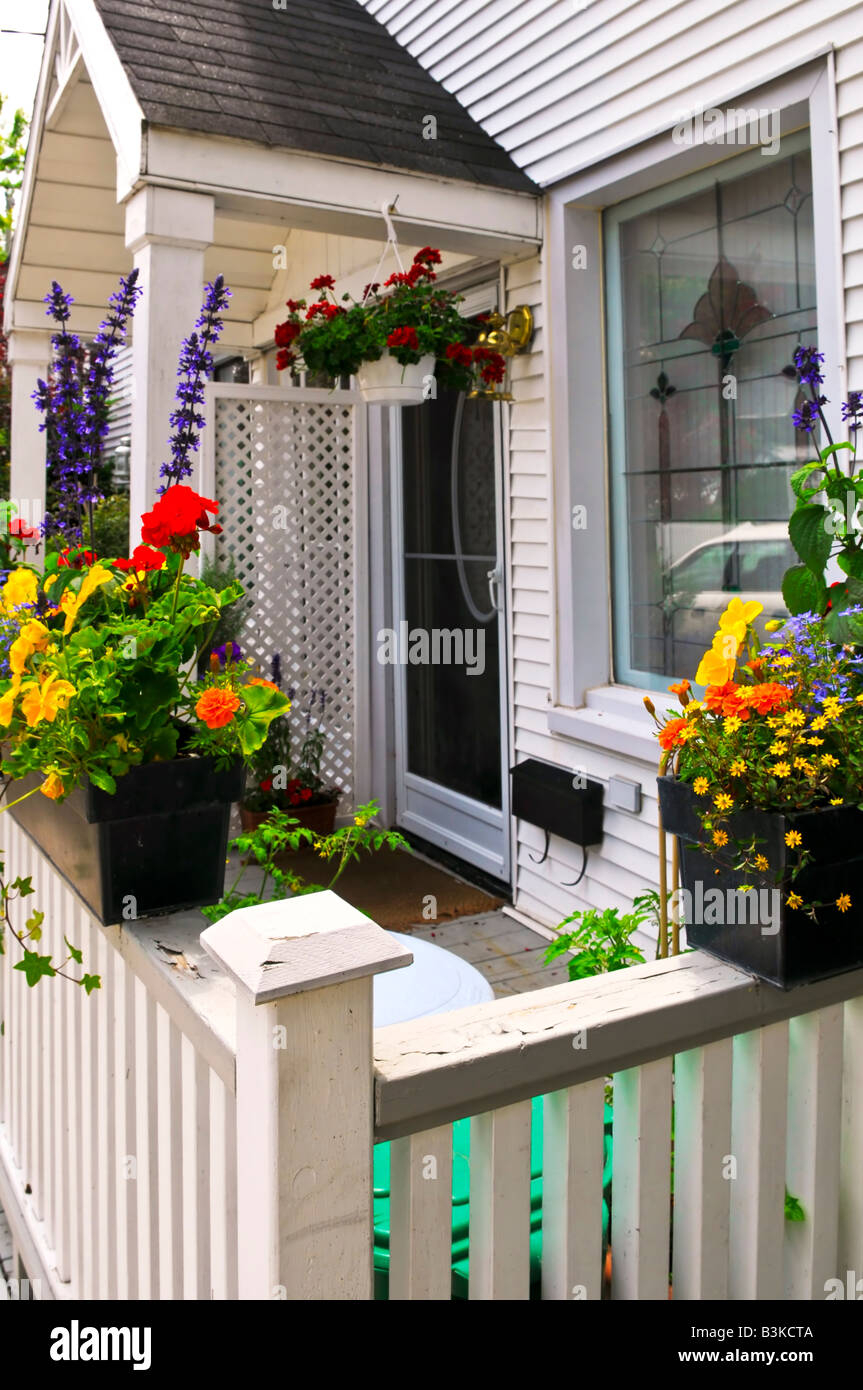 House porch with flower boxes on the railing Stock Photo - Alamy