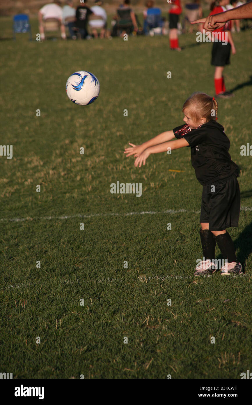 Girl Throwing Soccer Ball High Resolution Stock Photography and Images ...