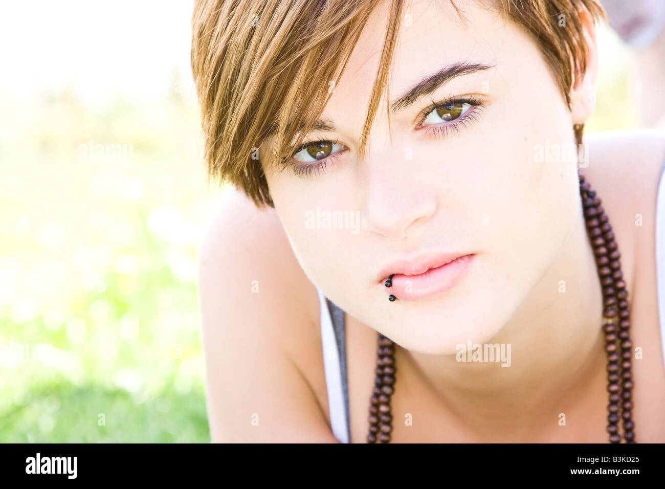 Beautiful pierced woman staring at camera Stock Photo - Alamy