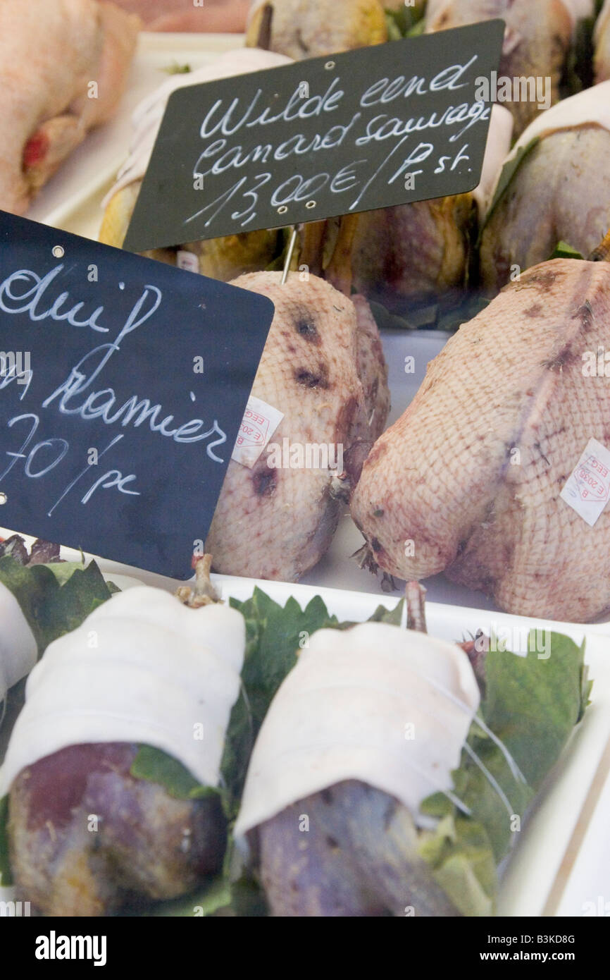 Window display of butchers showing local fresh game and fowl produce ...