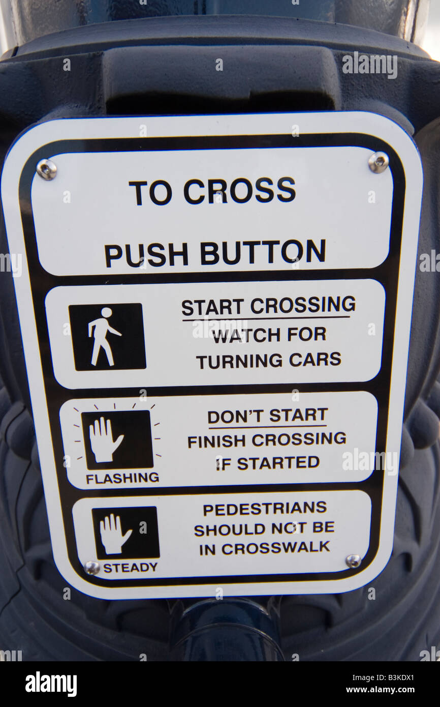 Traffic sign on a metal pole reading TO CROSS PUSH BUTTON Stock Photo ...