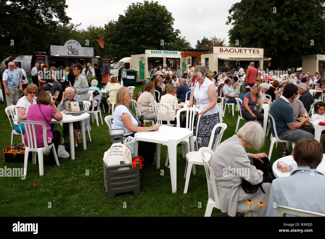 outdoor seating area people can eat and drink food from the trailers ...