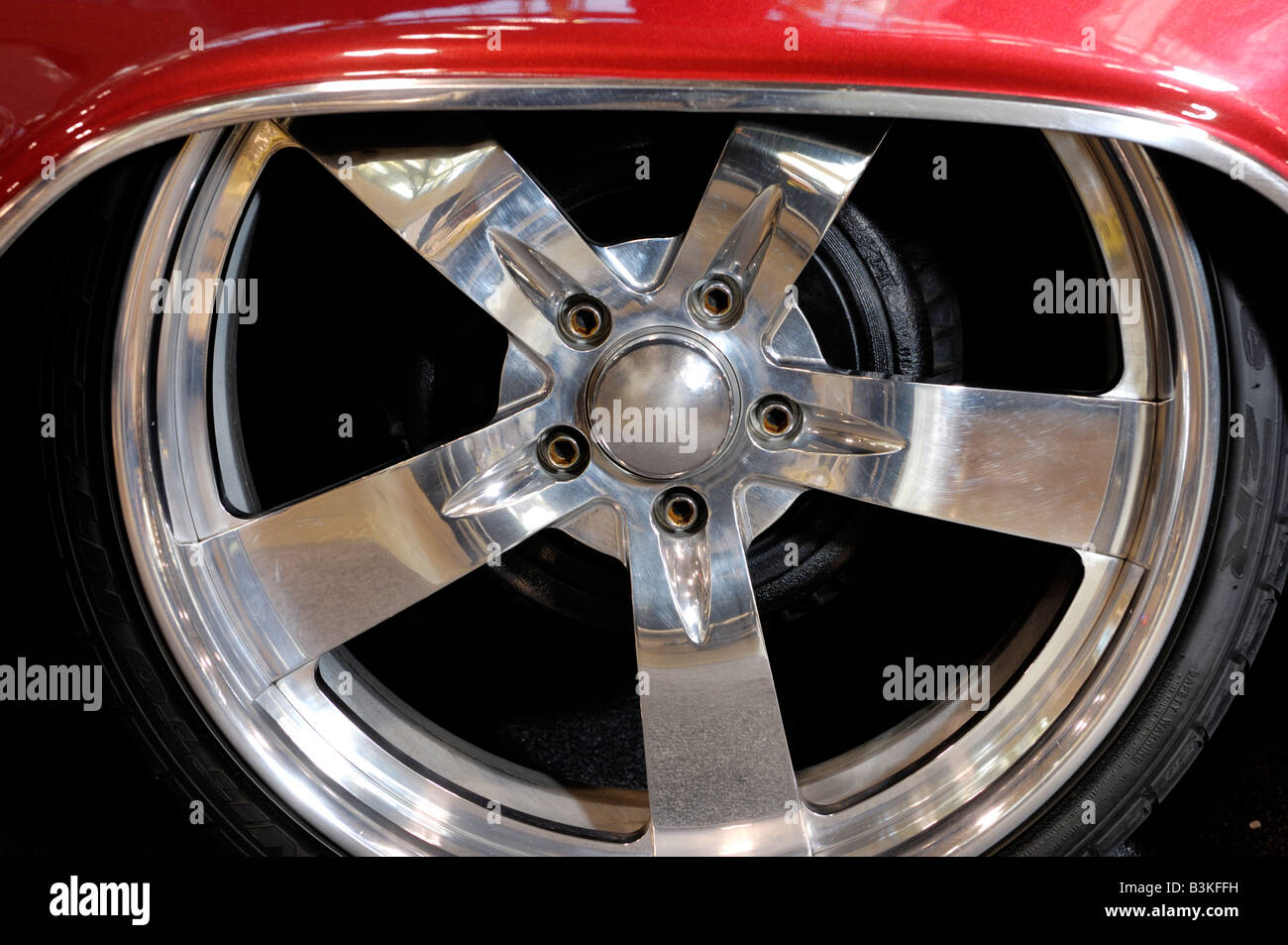 Shiny classic car wheel Stock Photo - Alamy