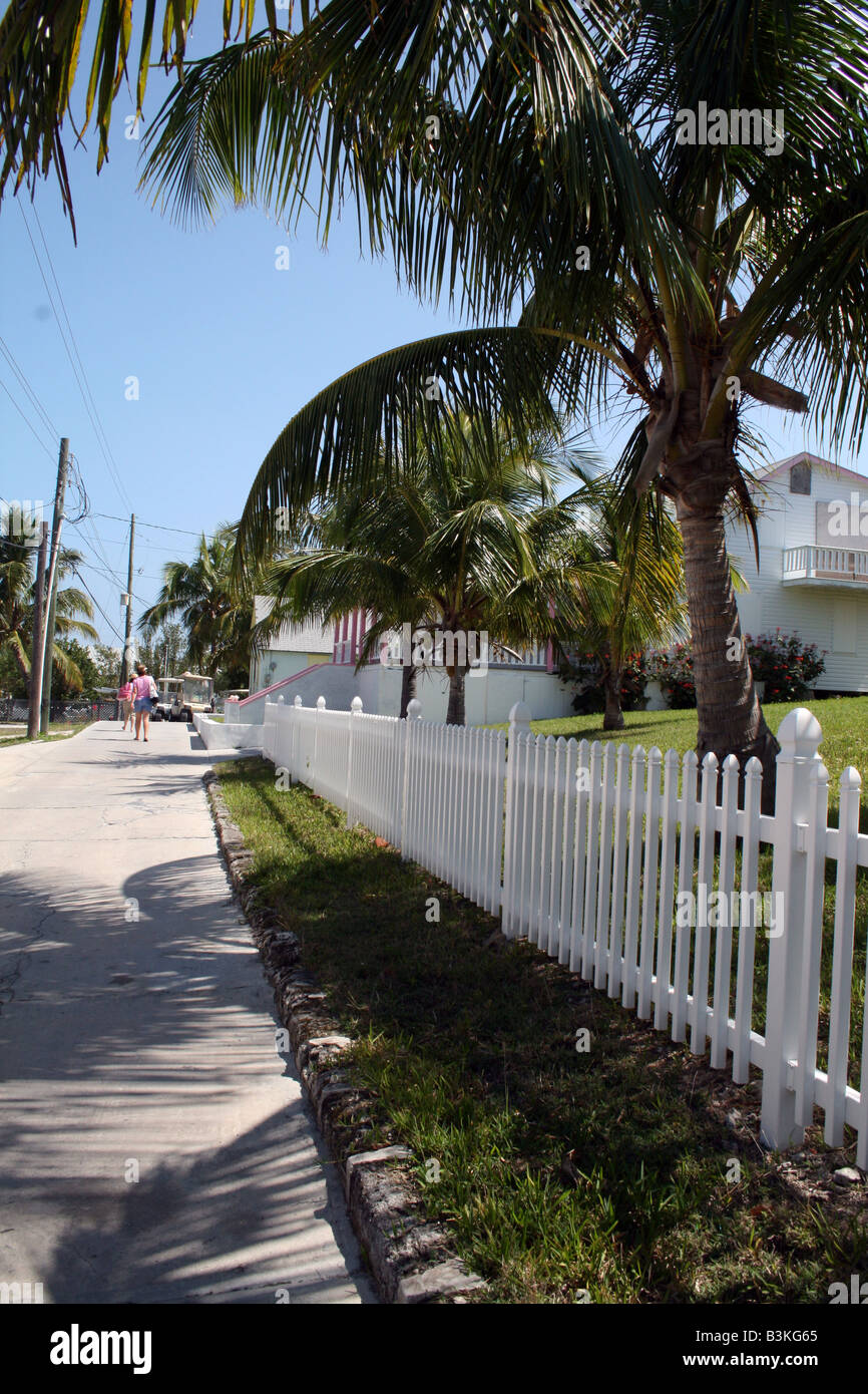 White fence and palm trees along main road of Man-O-War Cay, Abaco ...