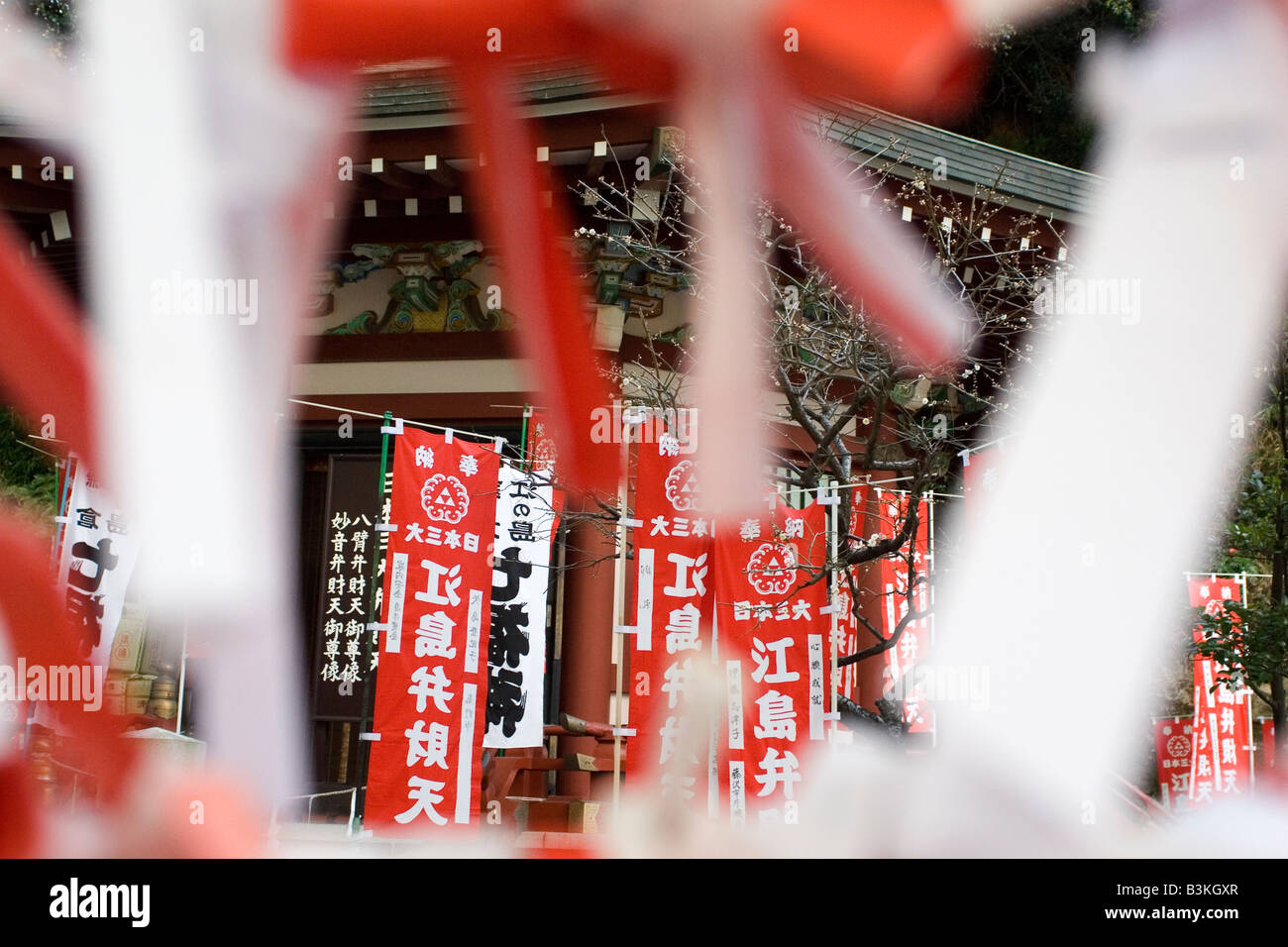 Red and white prayer flags at the Kotoku-in Temple in Enoshima, Japan ...