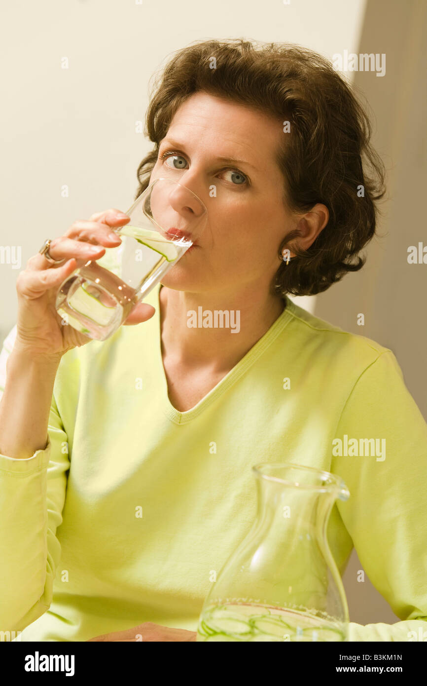 Woman drinking water Stock Photo - Alamy