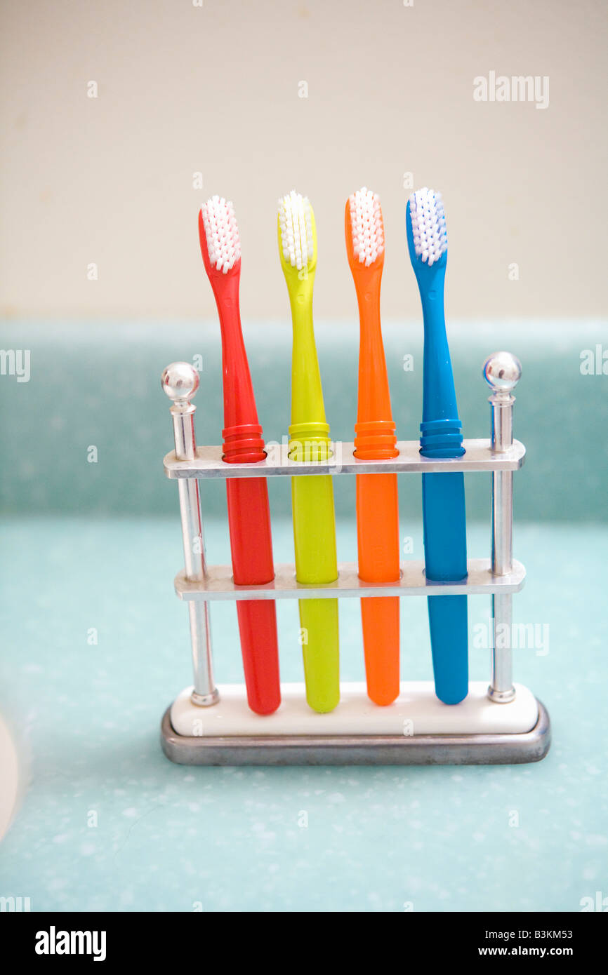 Assorted colorful toothbrushes in stand Stock Photo - Alamy