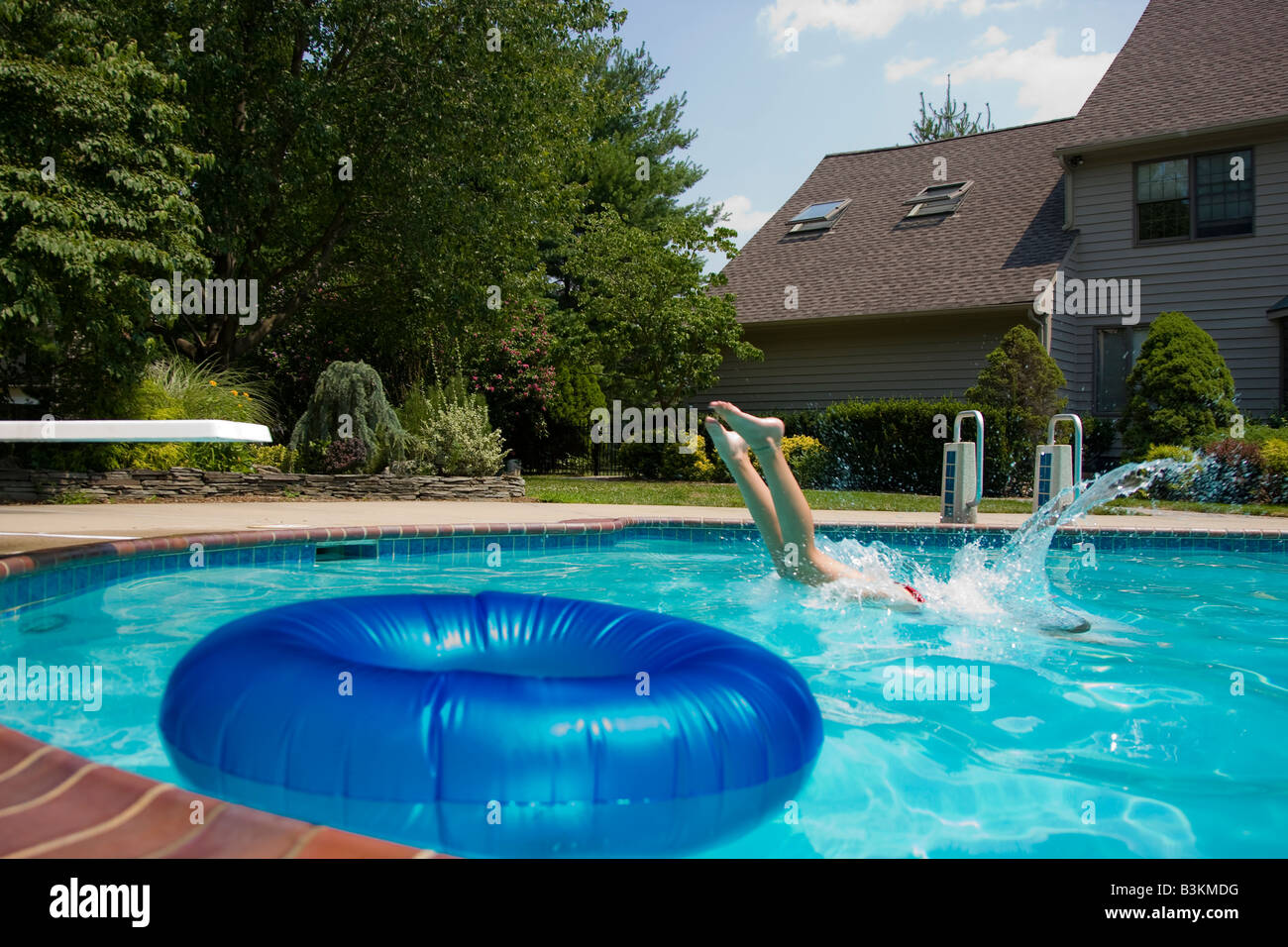 Child diving into a swimming pool Stock Photo - Alamy